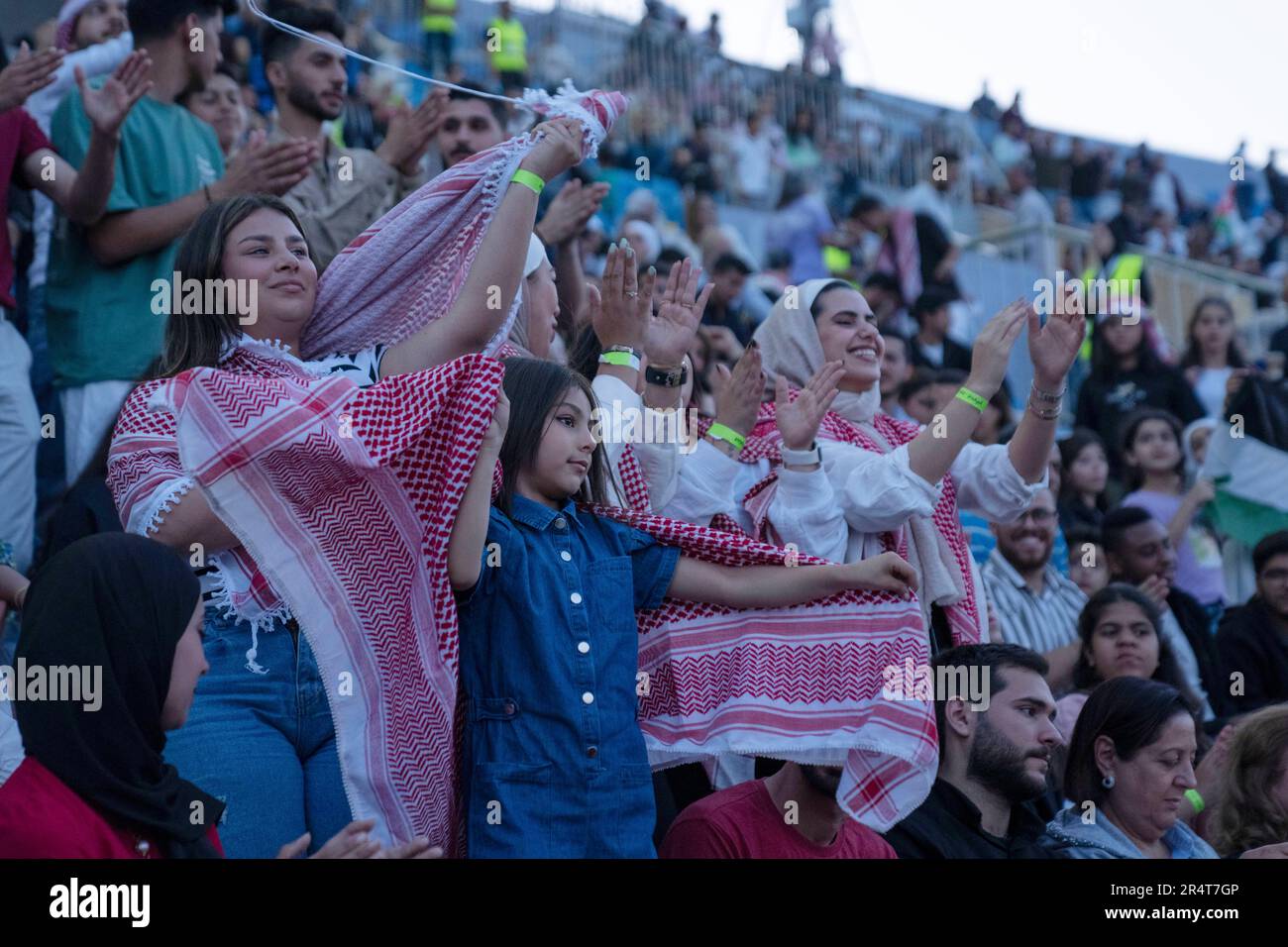Jordanian women wearing the traditional Jordanian red and white ...
