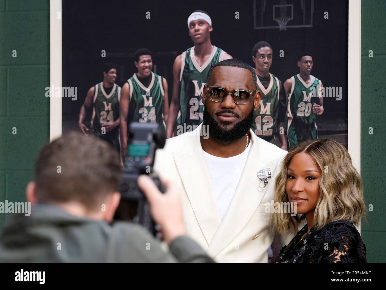 NBA basketball player LeBron James and his wife Savannah pose for a photo at the premiere of the ...