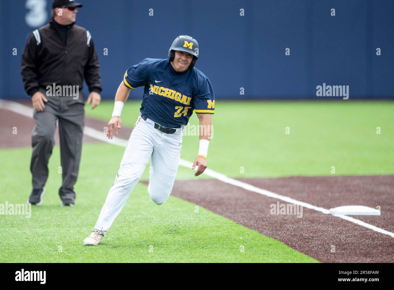 Michigan Wolverines outfielder Joey Velazquez (24) runs toward home ...