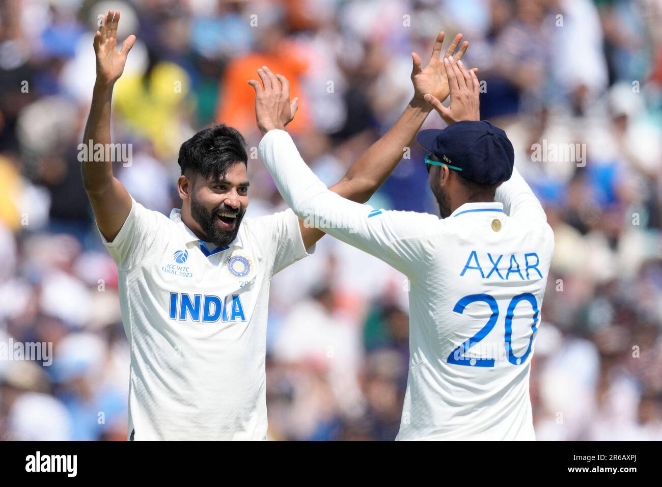 India's Mohammed Siraj, left celebrates with India's Axar Pate, a ...
