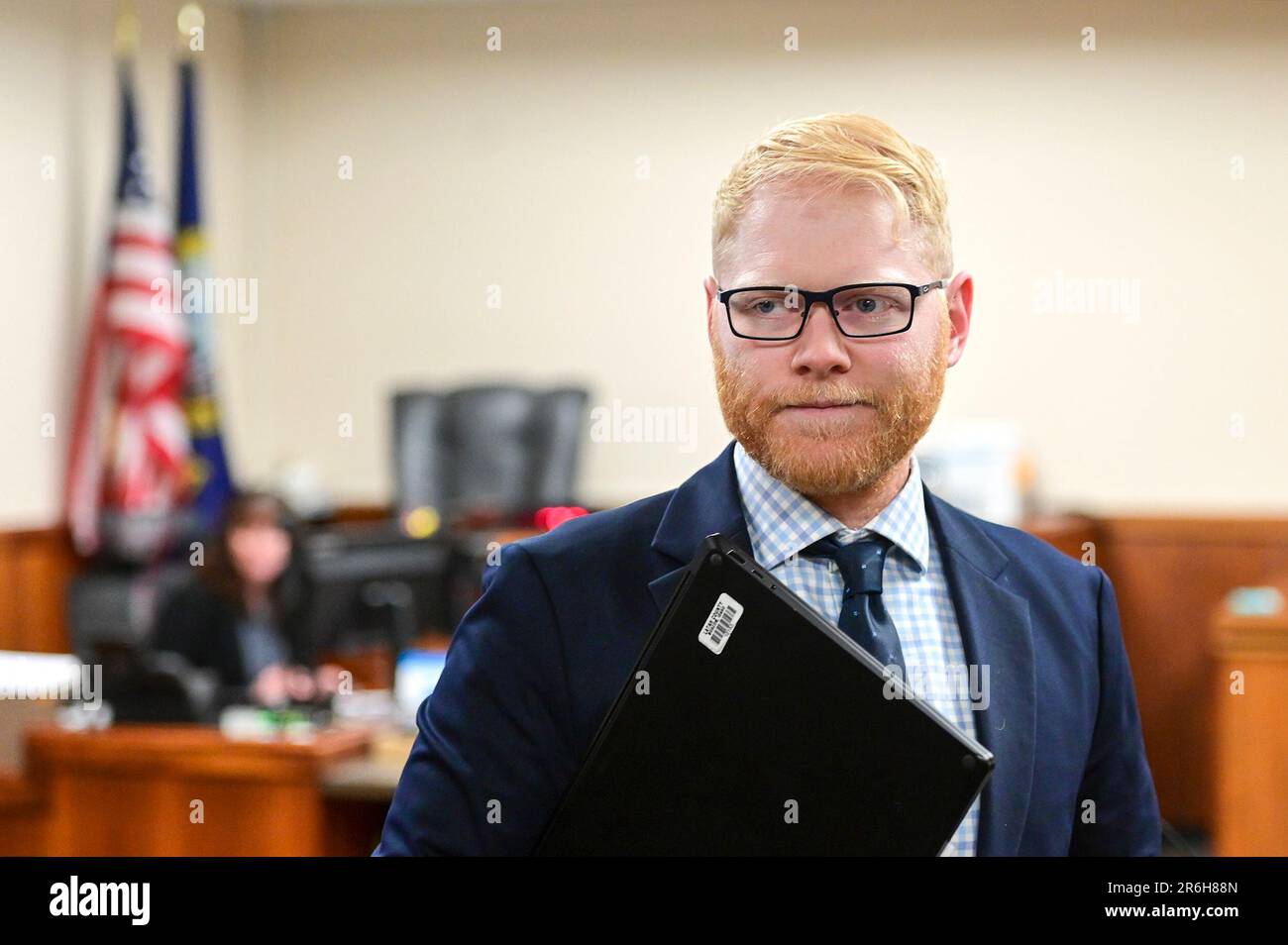 Latah County Prosecutor Bradley Rudley prepares to exit the courtroom ...