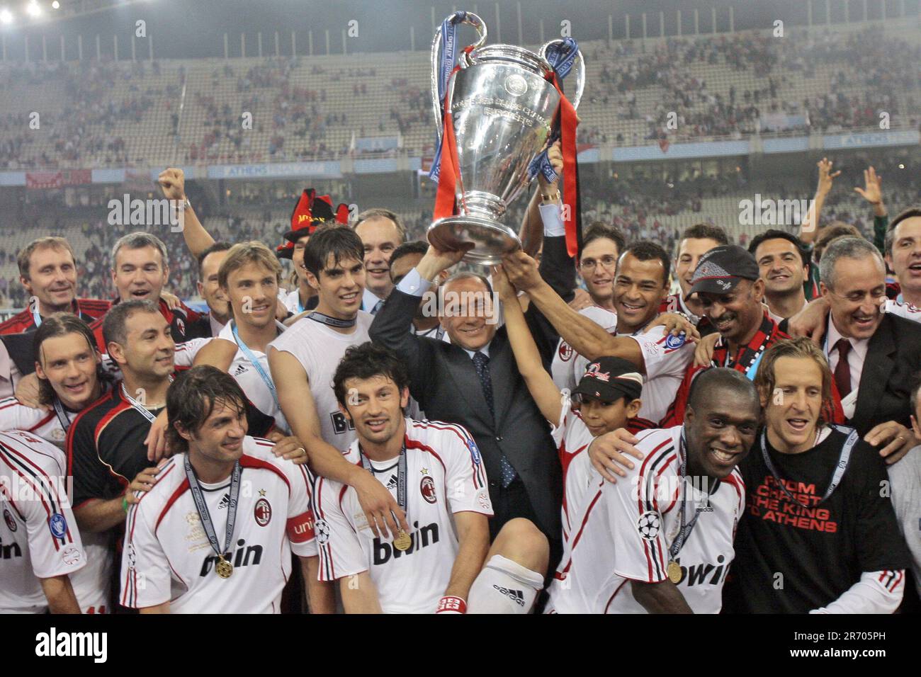 FILE - AC Milan's Silvio Berlusconi raises the trophy aloft as he ...