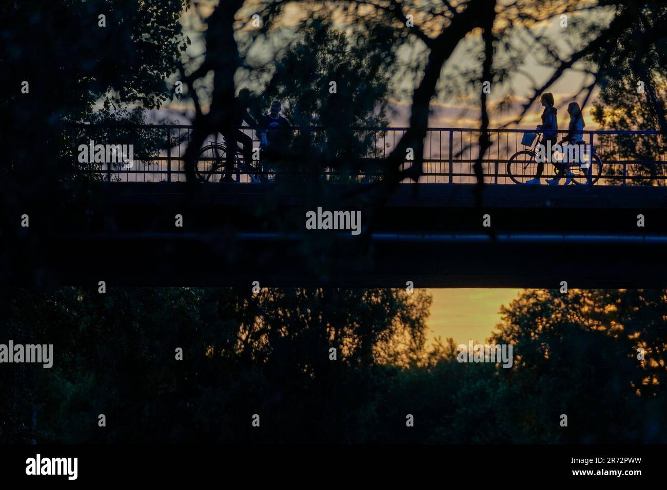 People walk across a bridge over the Great Backa canal in the northern Serbian town of Sombor ...