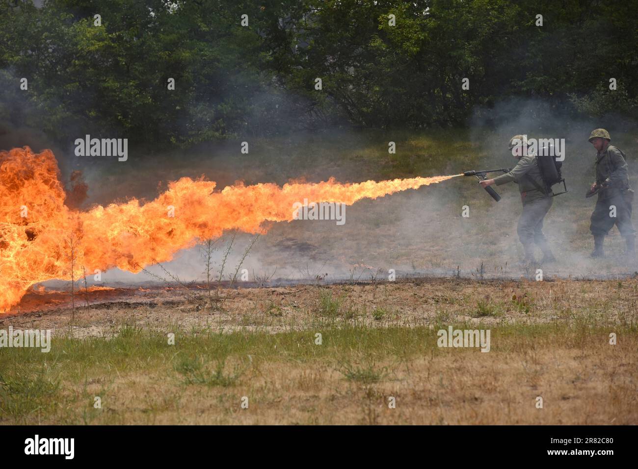 Reenactors demonstrate a U.S. World War II-era flamethrower, Sunday ...