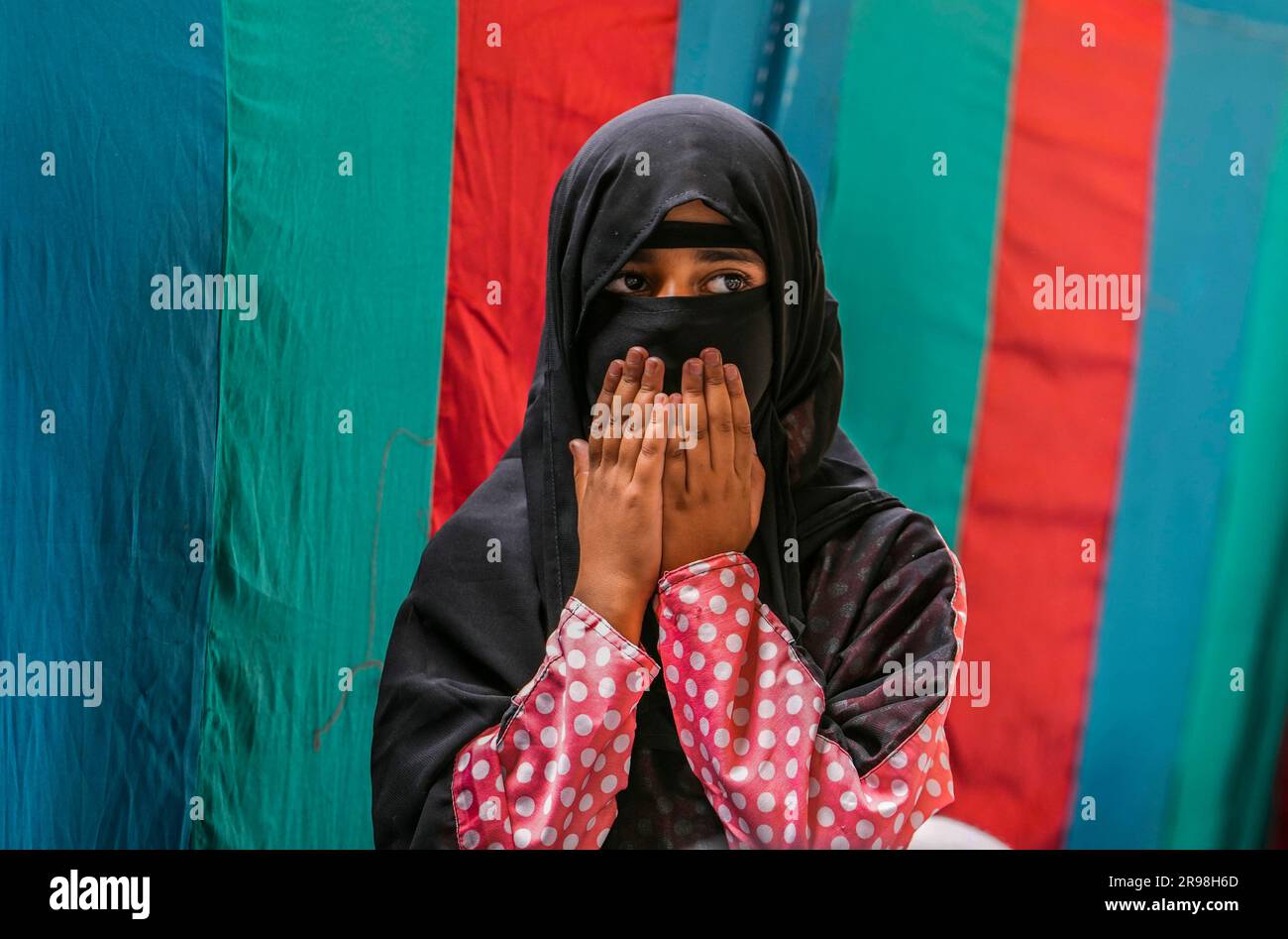 A Kashmiri Muslim girl prays outside the Shah-e Hamdan Mosque on the ...