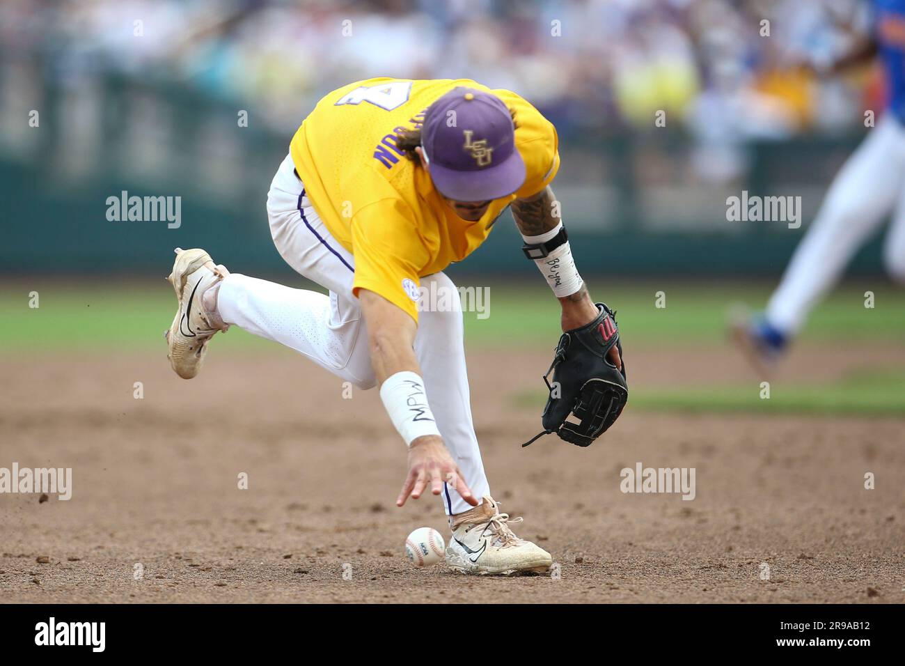LSU infielder Jordan Thompson (4) drops the ball on an error allowing ...