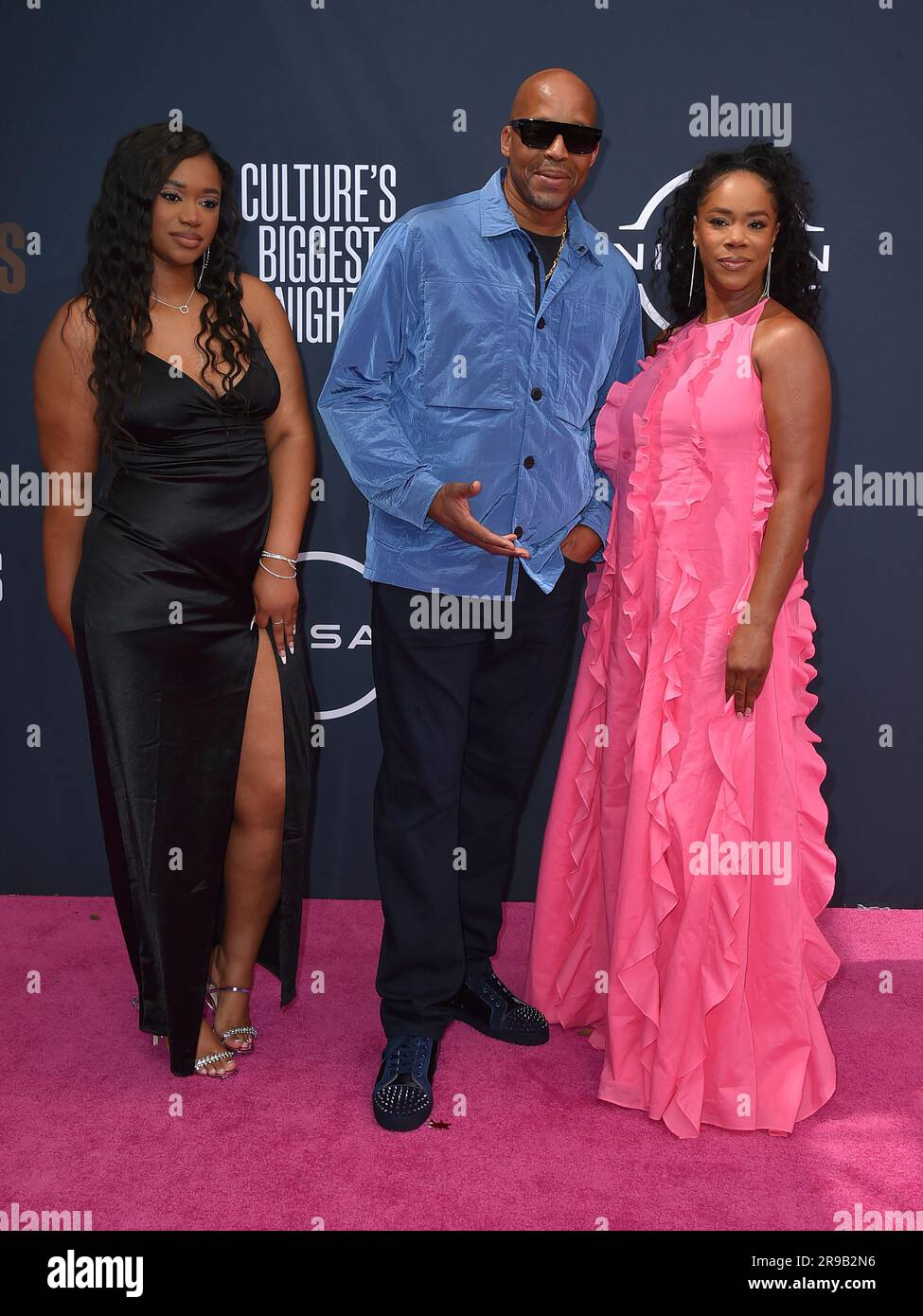 Larren Griffin, from left, Warren G and Tennille Griffin arrive at the ...