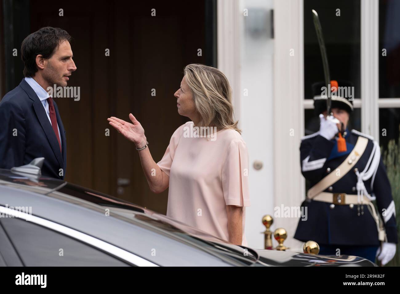 Netherlands Defense Minister Kajsa Ollongren, center, talks to Foreign ...