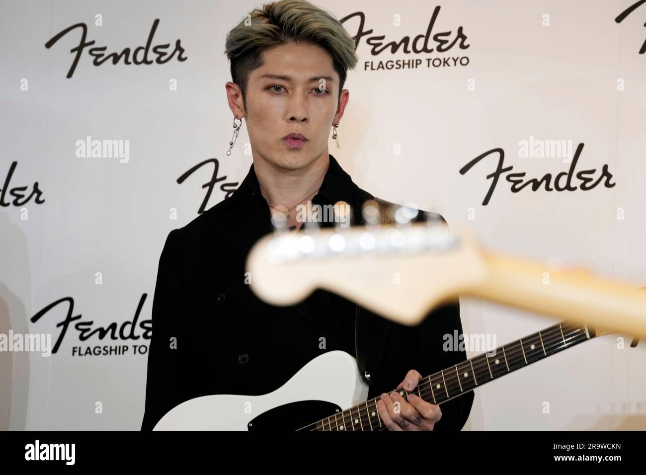 Japanese guitarist Miyavi holding his Fender guitar attends the opening ...