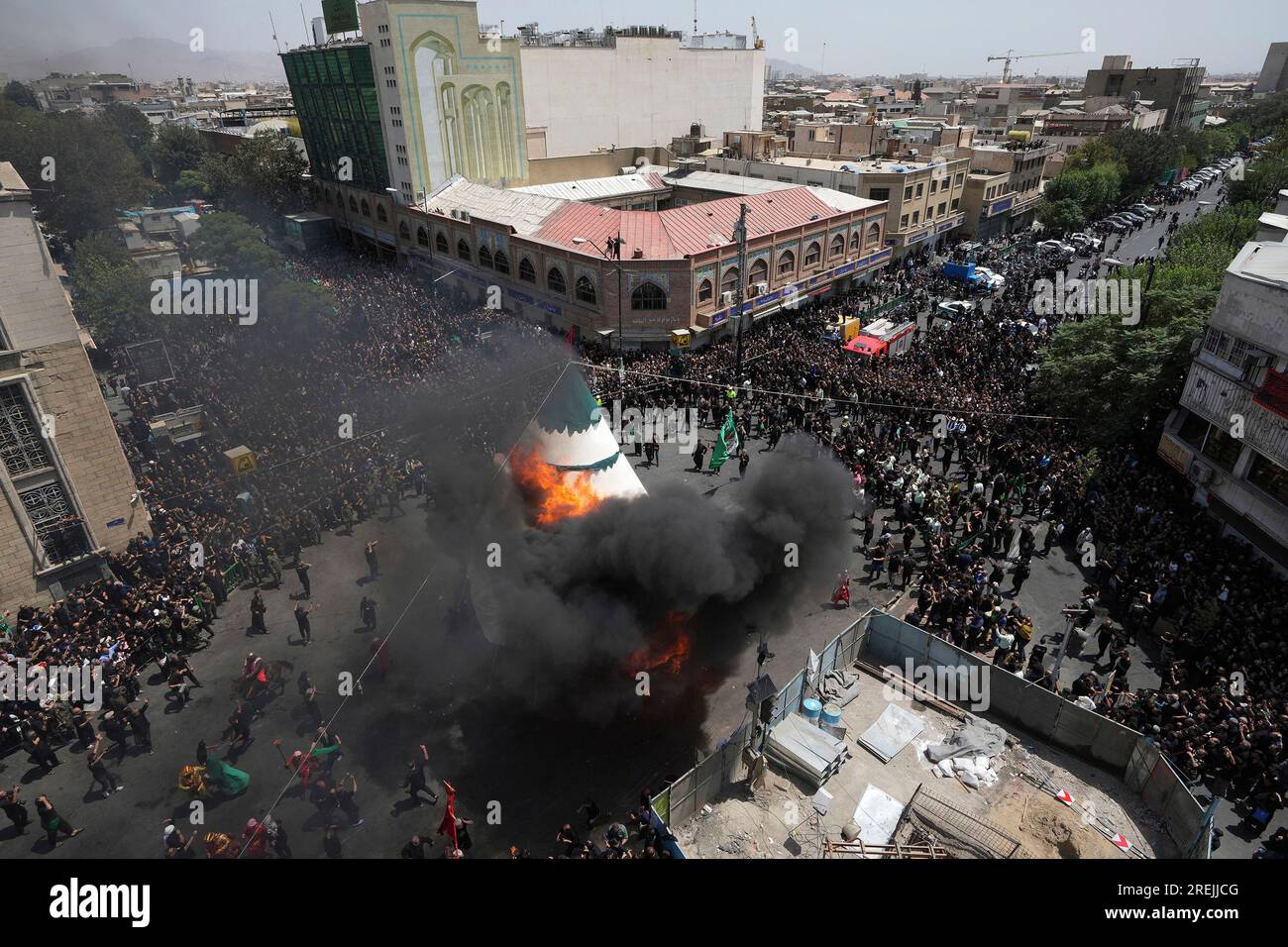 Iranian and Iraqi Shiite Muslims burn a tent at a re-enactment of the ...