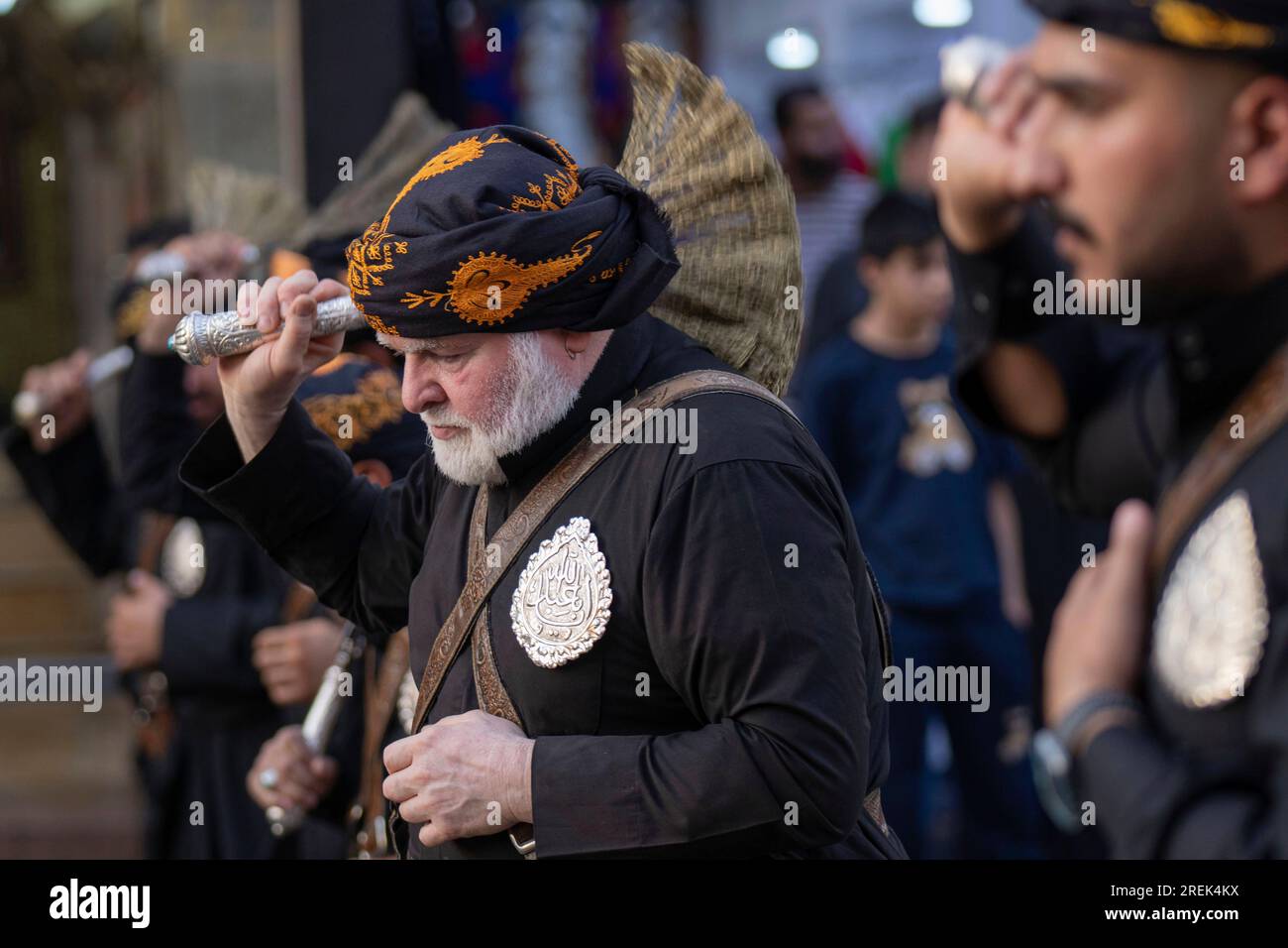 Shiite faithful pilgrims beat themselves with chains as a sign of grief ...