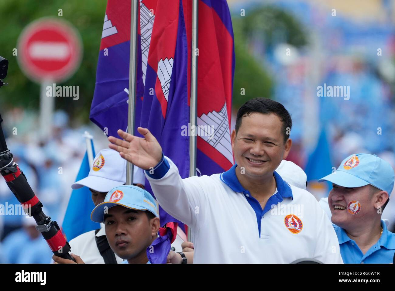Hun Manet, foreground, a son of Cambodia Prime Minister Hun Sen, waves ...