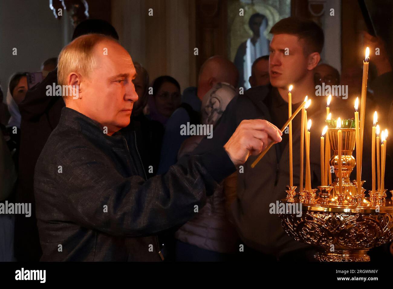 FILE - Russian President Vladimir Putin lights a candle as he visits ...