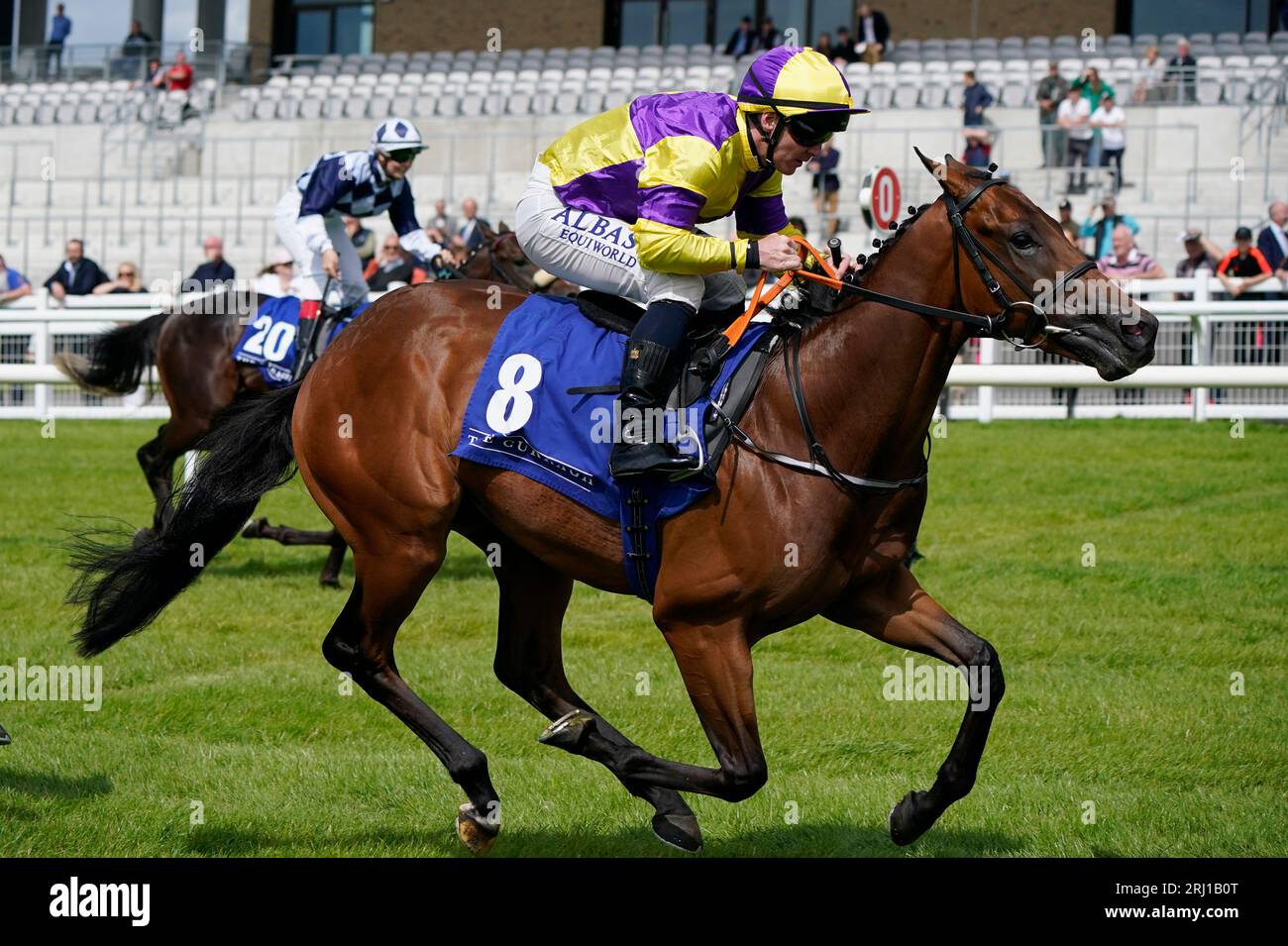 Megarry monté par Garry Carroll (à droite) sur leur chemin pour gagner ...