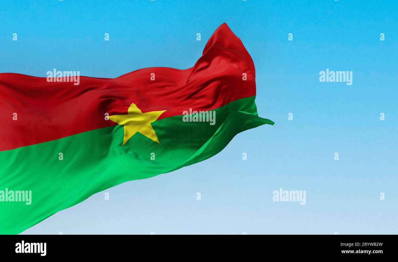 Drapeau national du Burkina Faso agitant dans le vent par temps clair ...