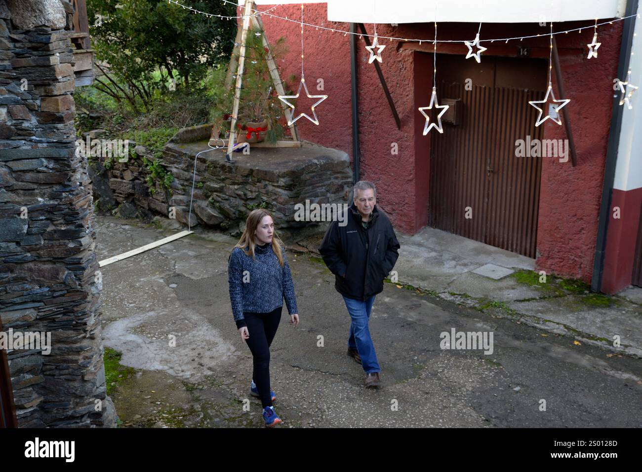 Several neighbors put up Christmas decorations on December 23, 2024, in ...