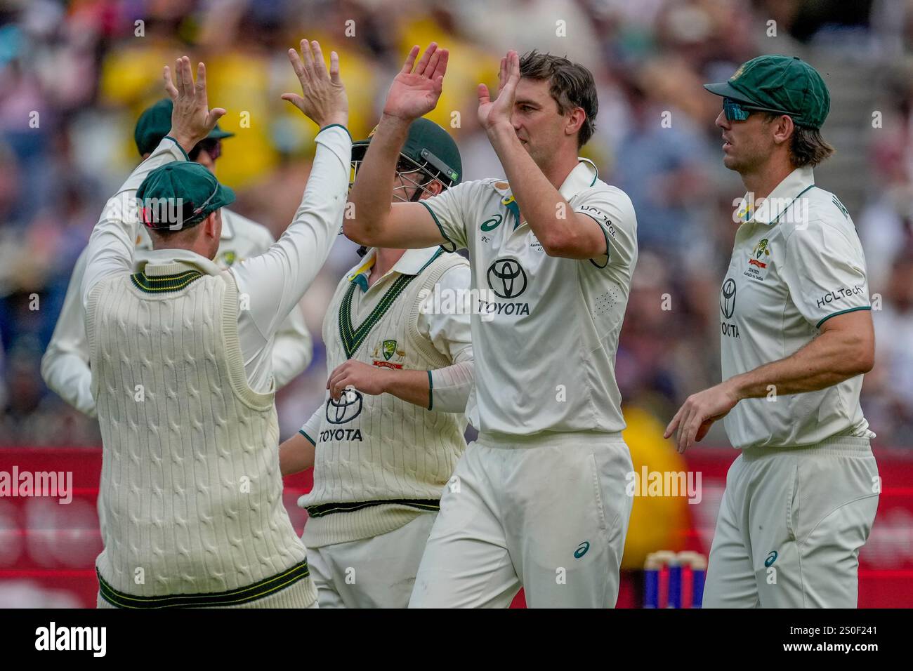 Australia's captain Pat Cummins, second right, celebrates the wicket of ...