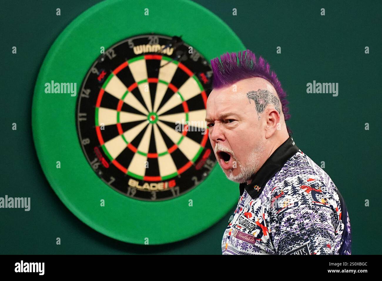 Peter Wright réagit lors de son match de quatrième tour contre Luke Humphries (non photographié ...