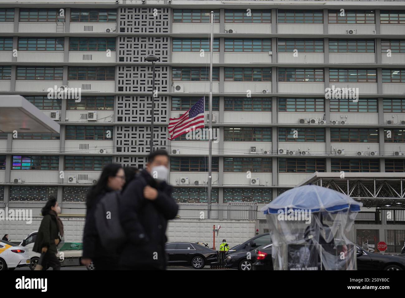 A U.S. national flag flies at half-mast for the late former U.S ...