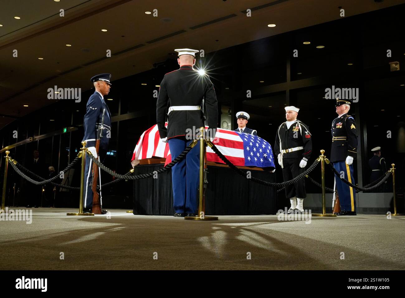 The Guard of Honor surrounds the flag-draped casket of former President Jimmy Carter as he lies ...