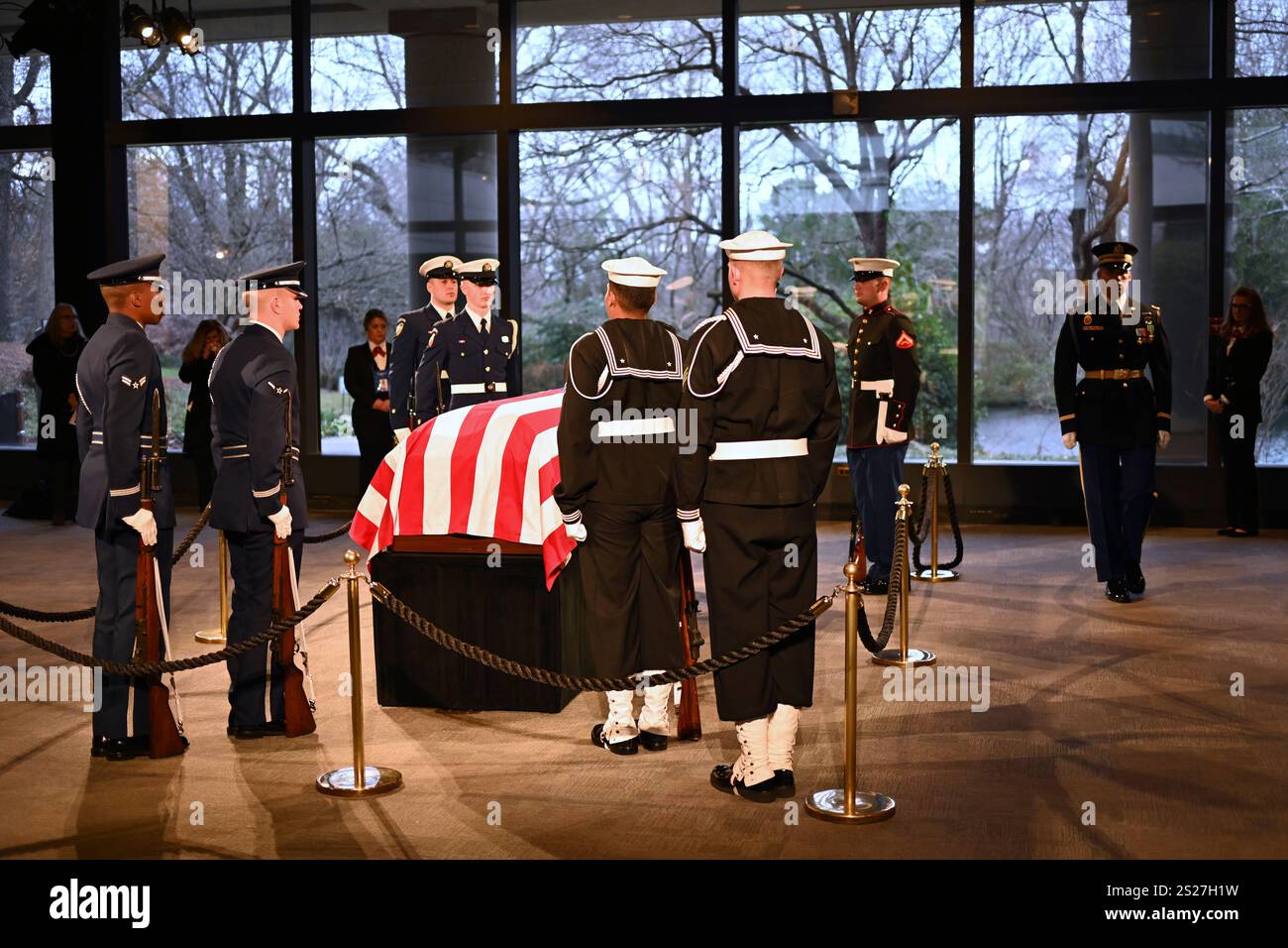 The guard of honor changes as mourners view the casket of former President Jimmy Carter as he ...