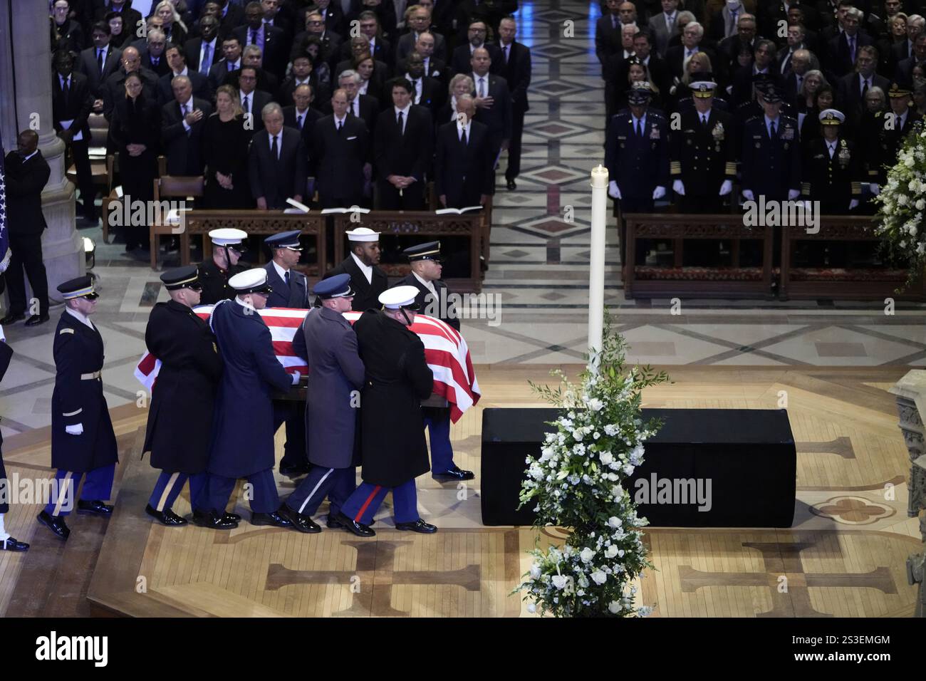 The flag-draped casket of former President Jimmy Carter arrives for a ...