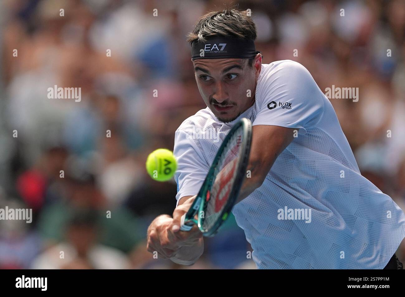 Lorenzo Sonego of Italy plays a backhand return to Learner Tien of the ...