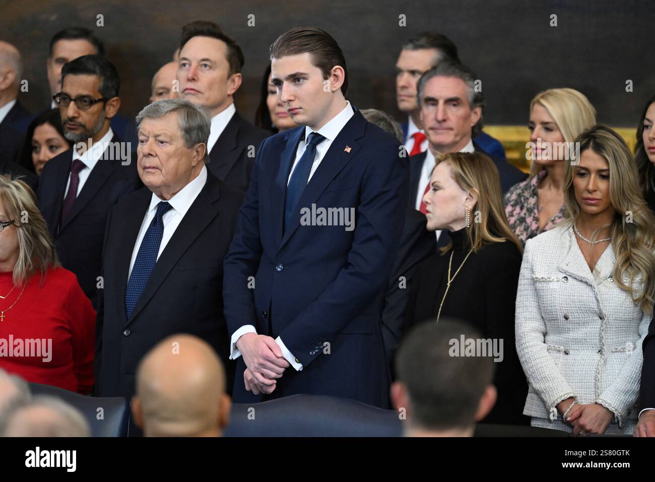 Barron Trump, center, attends the 60th Presidential Inauguration in the ...