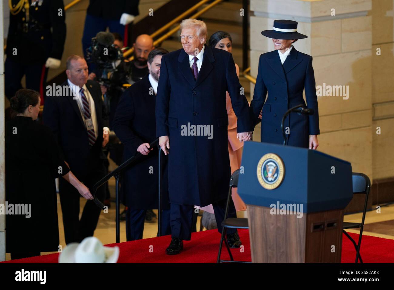 President Donald Trump, left, and first lady Melania Trump arrive speak ...