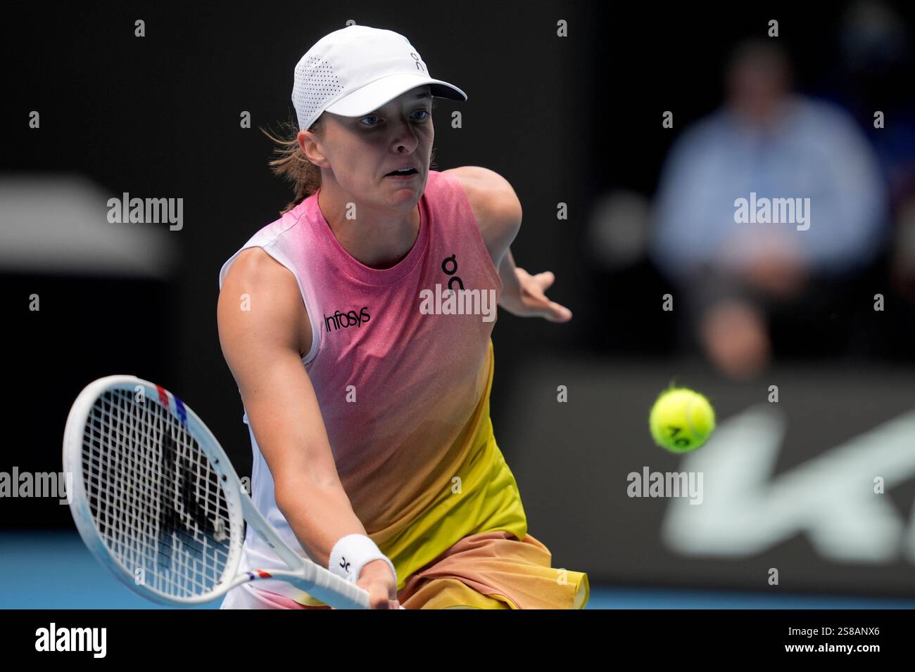 Iga Swiatek of Poland plays a forehand return to Emma Navarro of the U ...