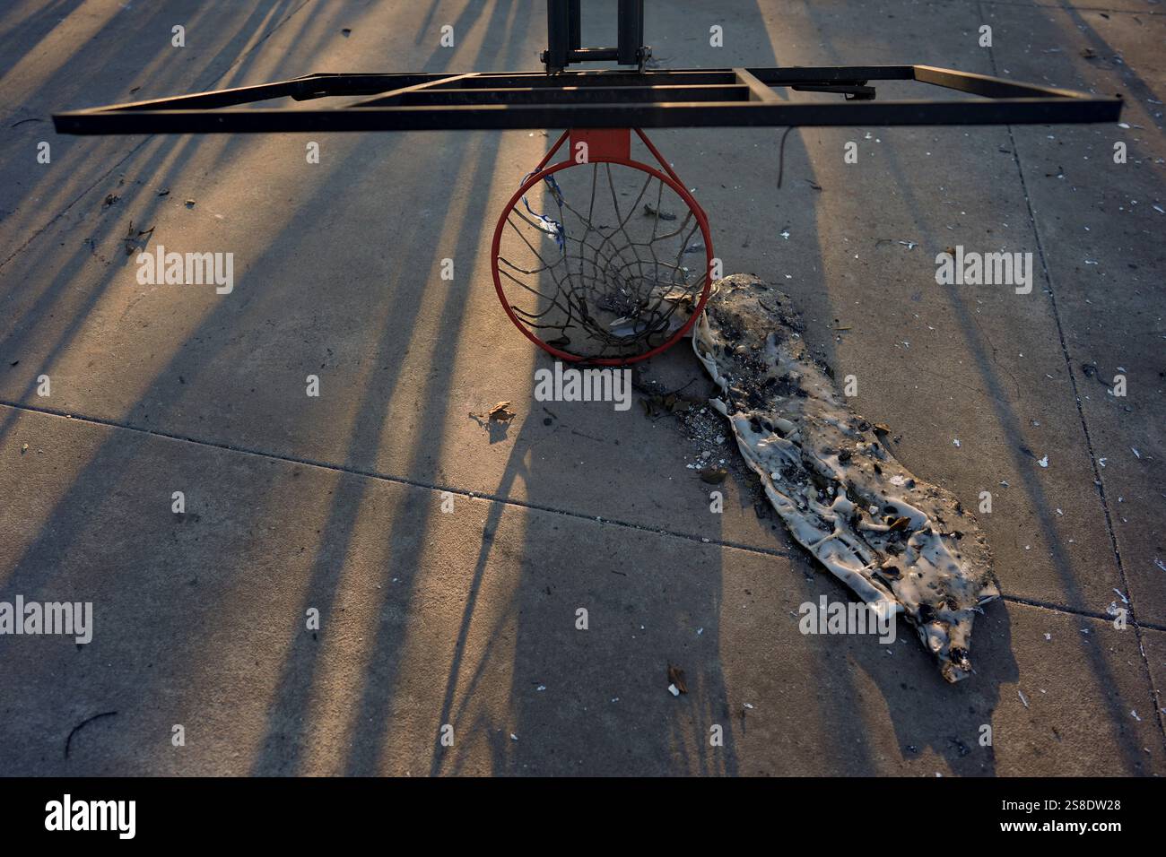 The remains of a basketball backboard toppled in the driveway of Chef ...