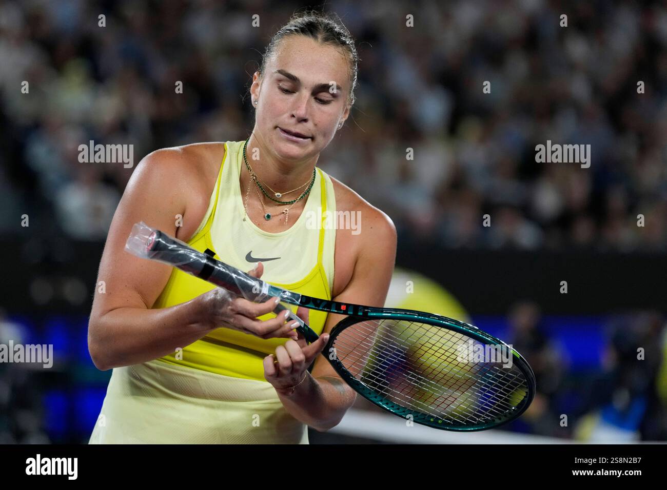 Aryna Sabalenka of Belarus changes rackets during her semifinal match ...