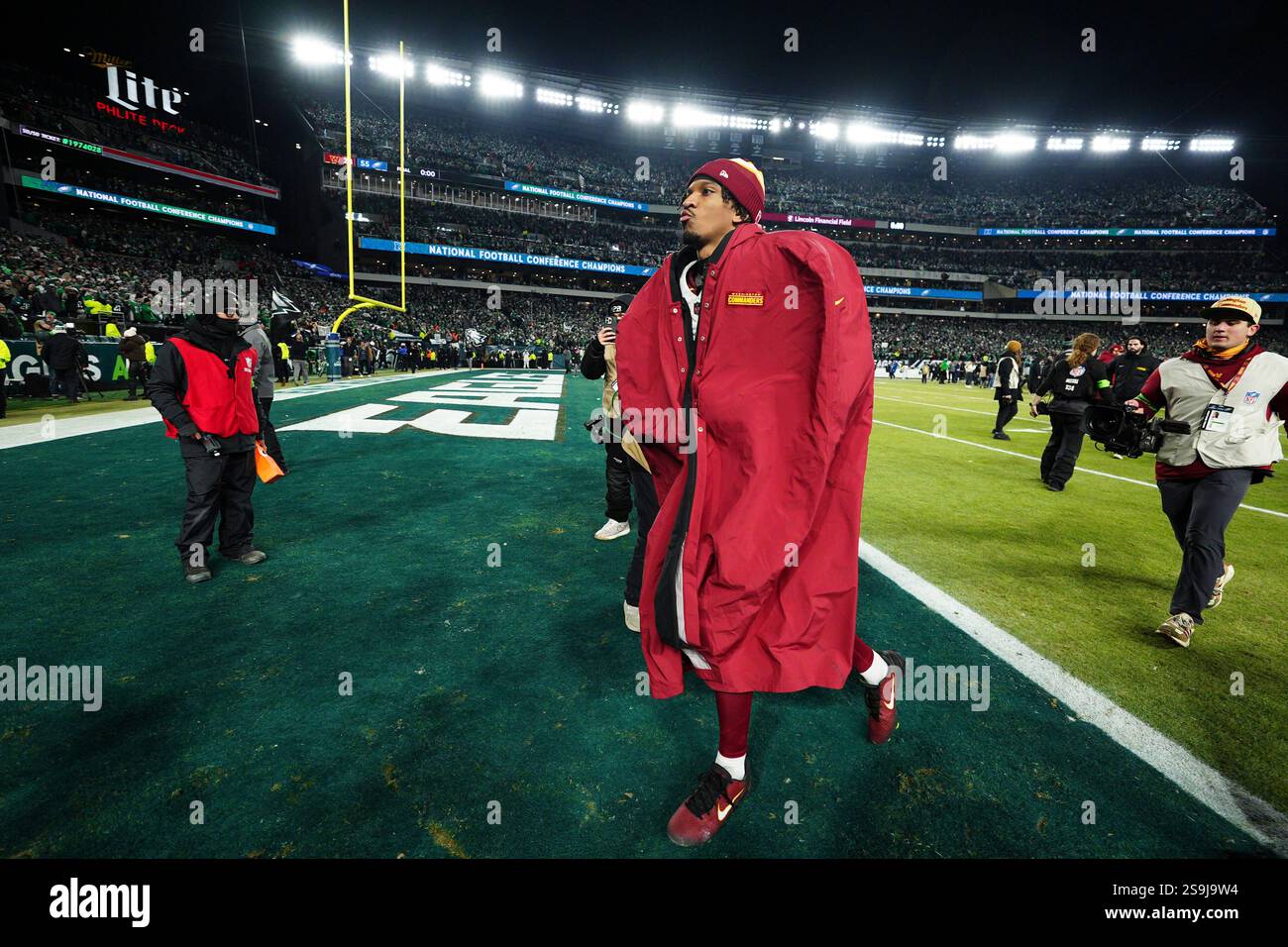 Washington Commanders quarterback Jayden Daniels leaves the field after ...