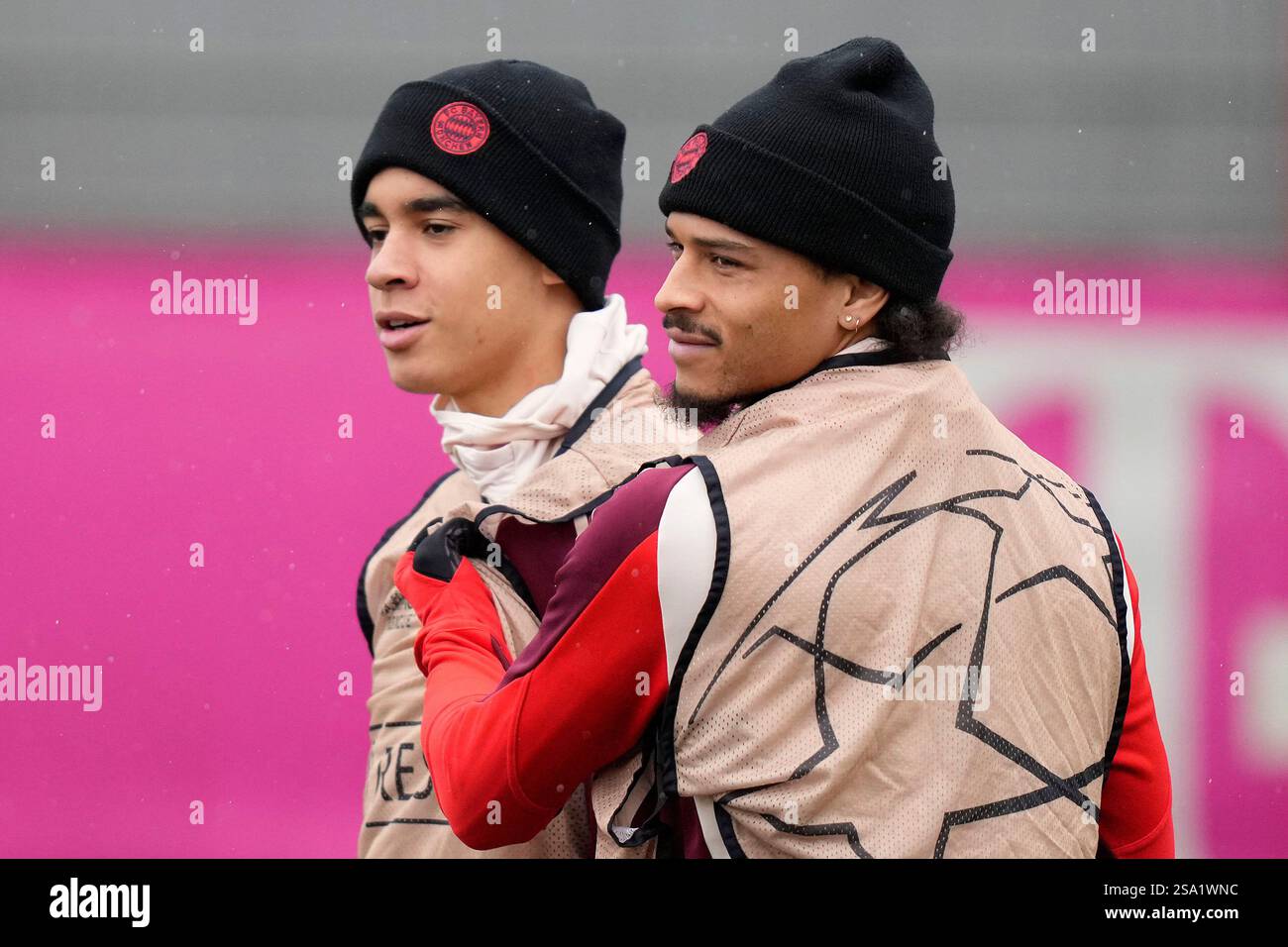 Bayern's Jamal Musiala, left, and Leroy Sane arrive for a training ...