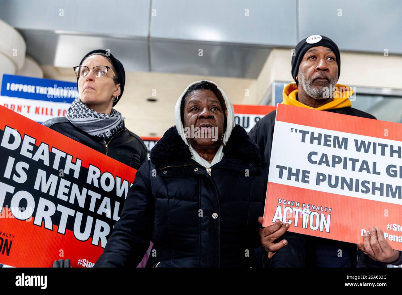 Lizz Schallert, left, and Charles Keith, right, stand in solidarity ...