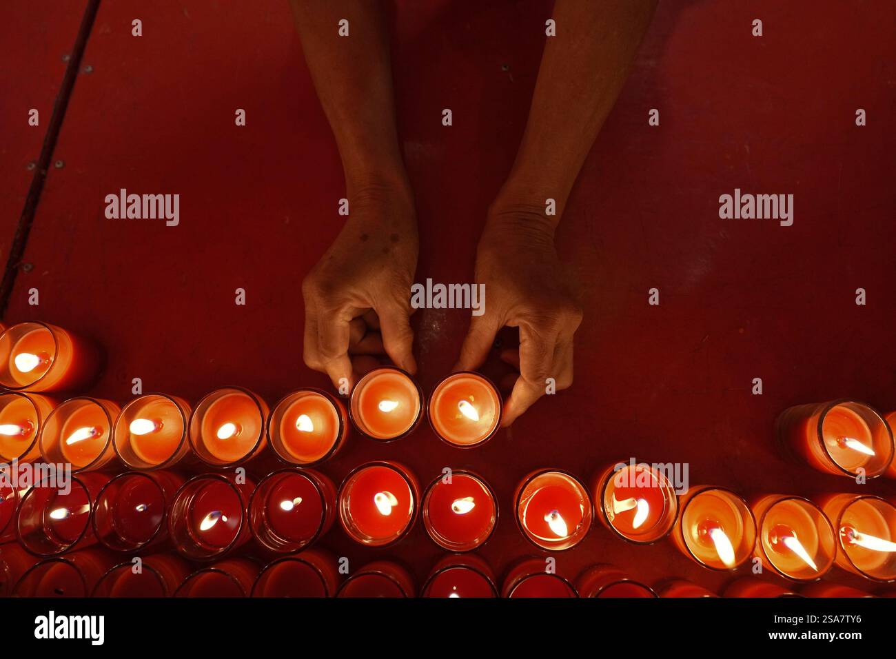 Ethnic Chinese Thai lay down candles after praying at the Leng Nuei Yee ...