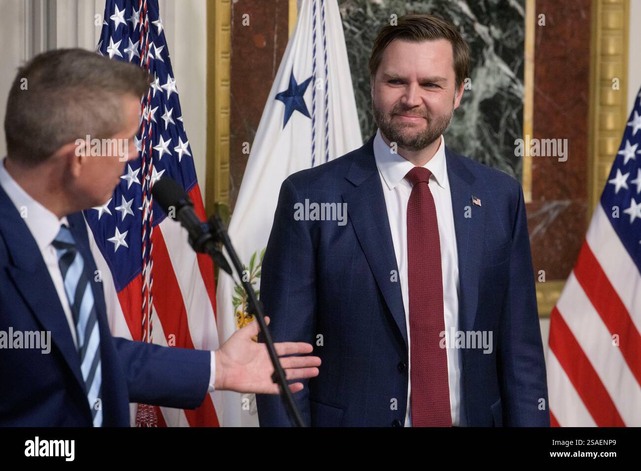 Transportation Secretary Sean Duffy, left, speaks after being sworn in ...