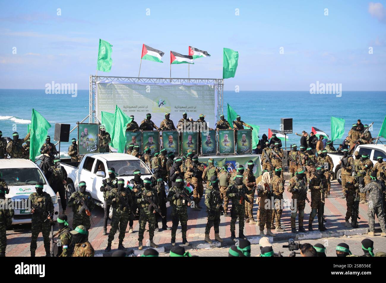 Hamas fighters deploy at the stage where the hand over of American ...