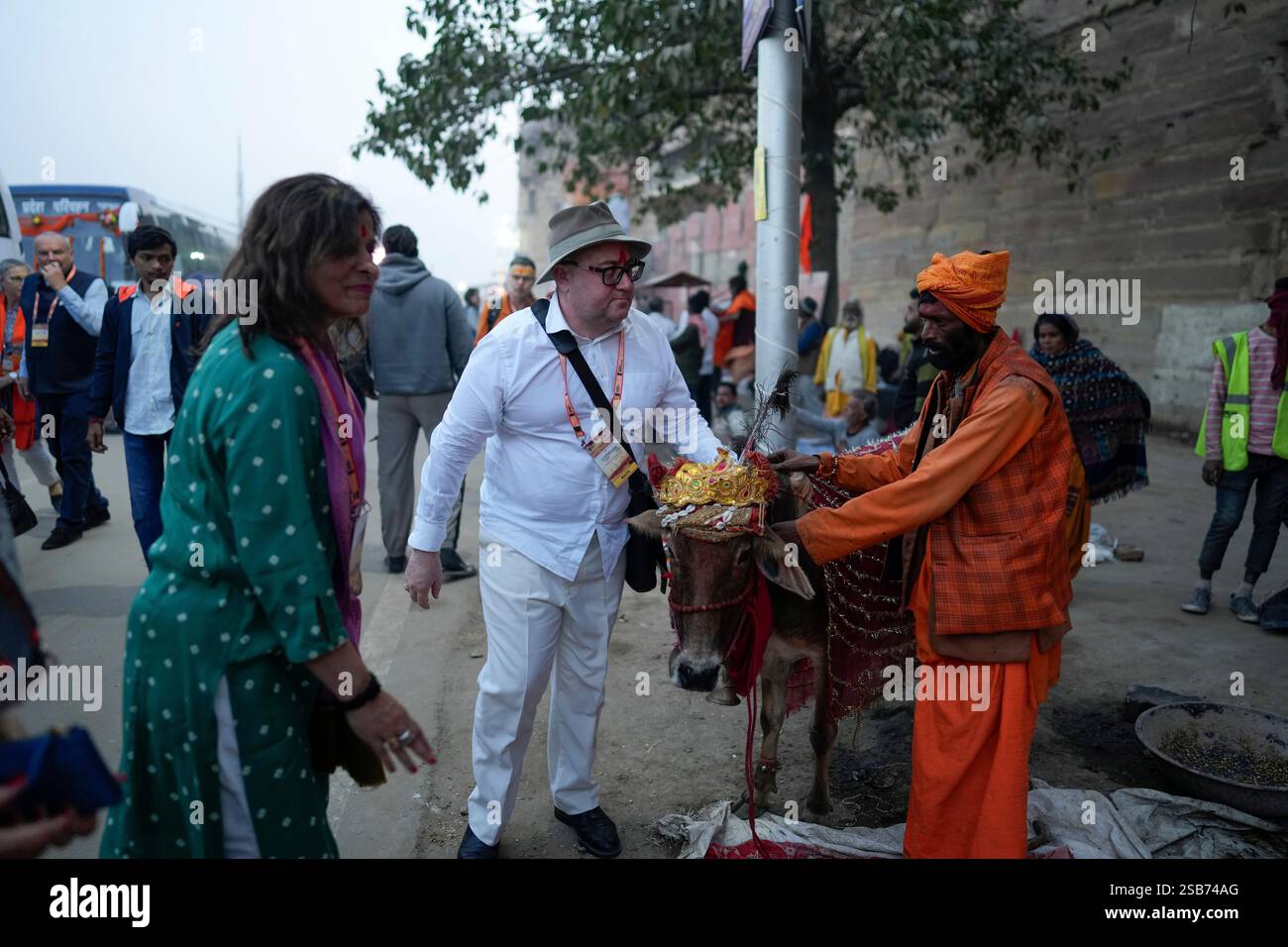 Ambassador of Malta, Reuben Gauci, touches a cow after during the ...