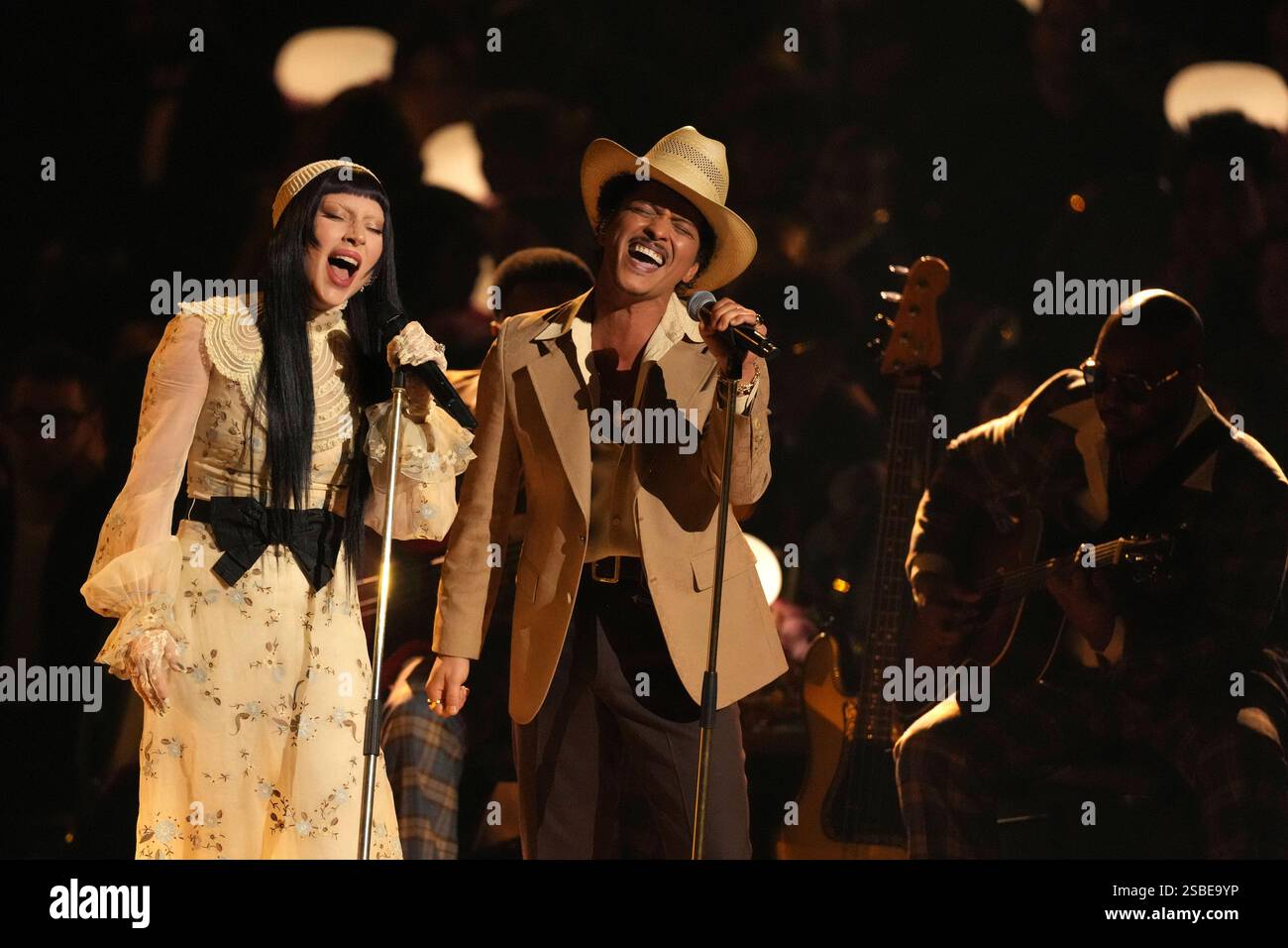 Lady Gaga, left, and Bruno Mars perform "California Dreamin'" during the 67th annual Grammy ...