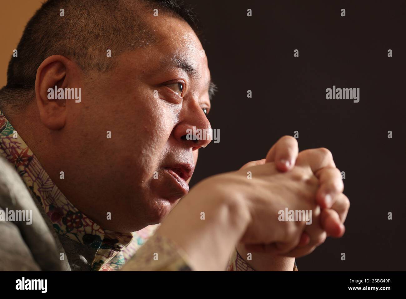 Japanese Author and former Foreign Ministry official Masaru Sato poses for photo during an ...