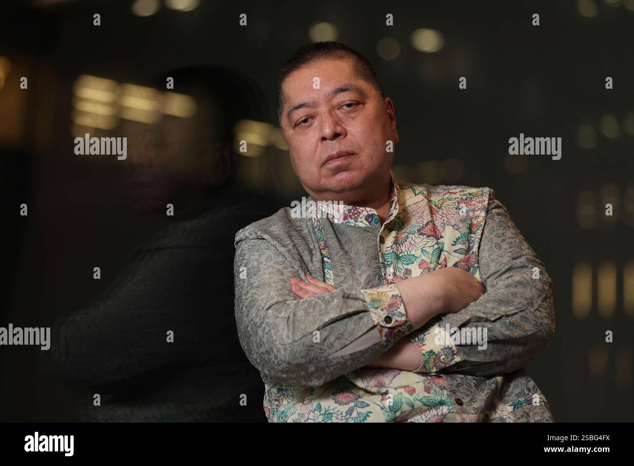 Japanese Author and former Foreign Ministry official Masaru Sato poses for photo during an ...