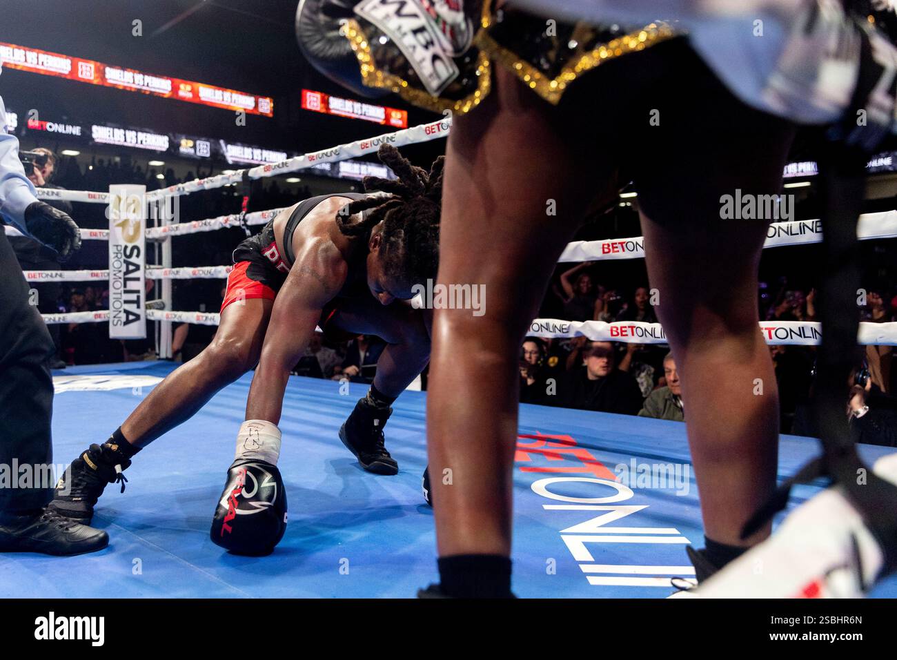 Danielle Perkins stumbles as she tries to gain her composure after a ...