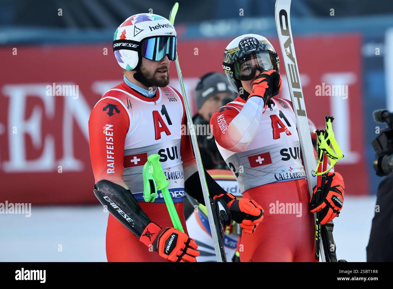 Switzerland's Wendy Holdener and Luca Aerni, left, during an alpine ski, World Championship team ...