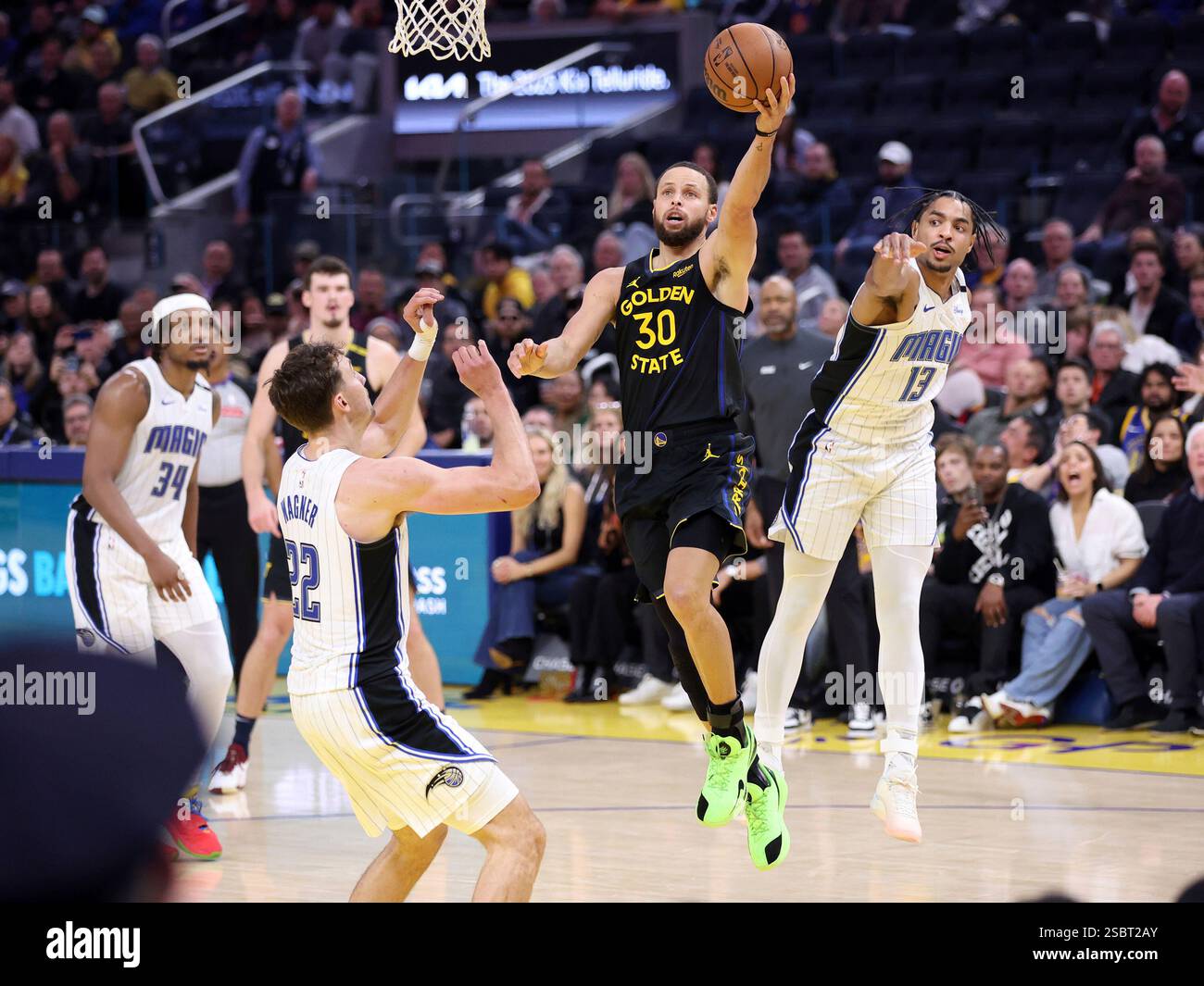Golden State Warriors' Stephen Curry scores between Orlando Magic's ...