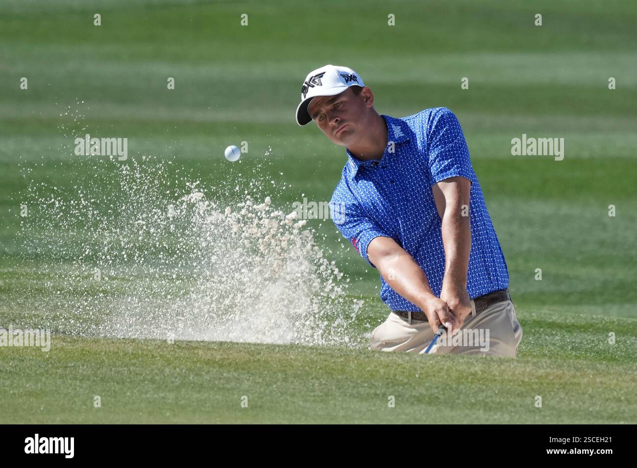 Christiaan Bezuidenhout, of South Africa, hits out of a bunker at the ...