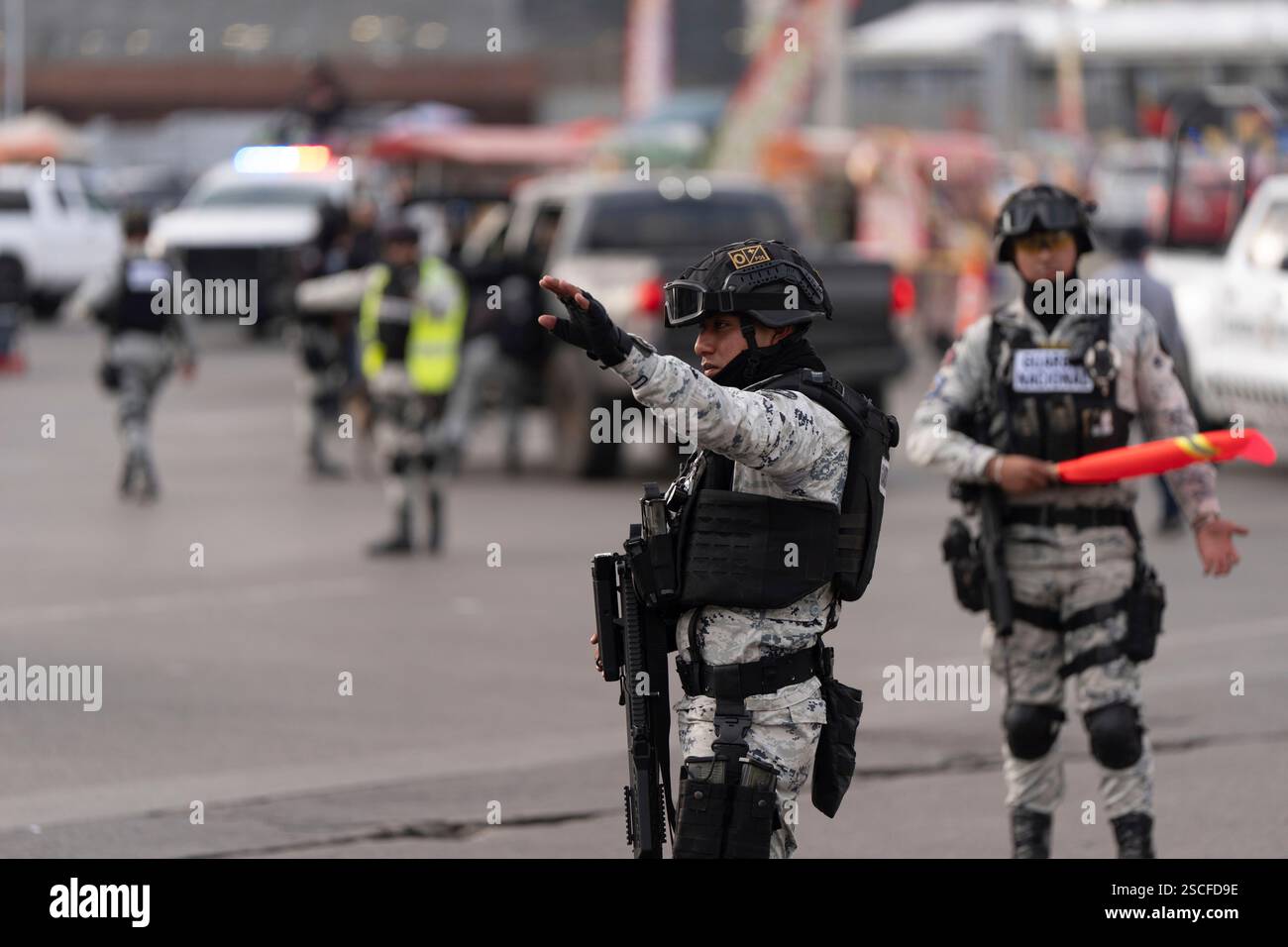 Members of Mexico's National Guard stand guard at an inspection ...
