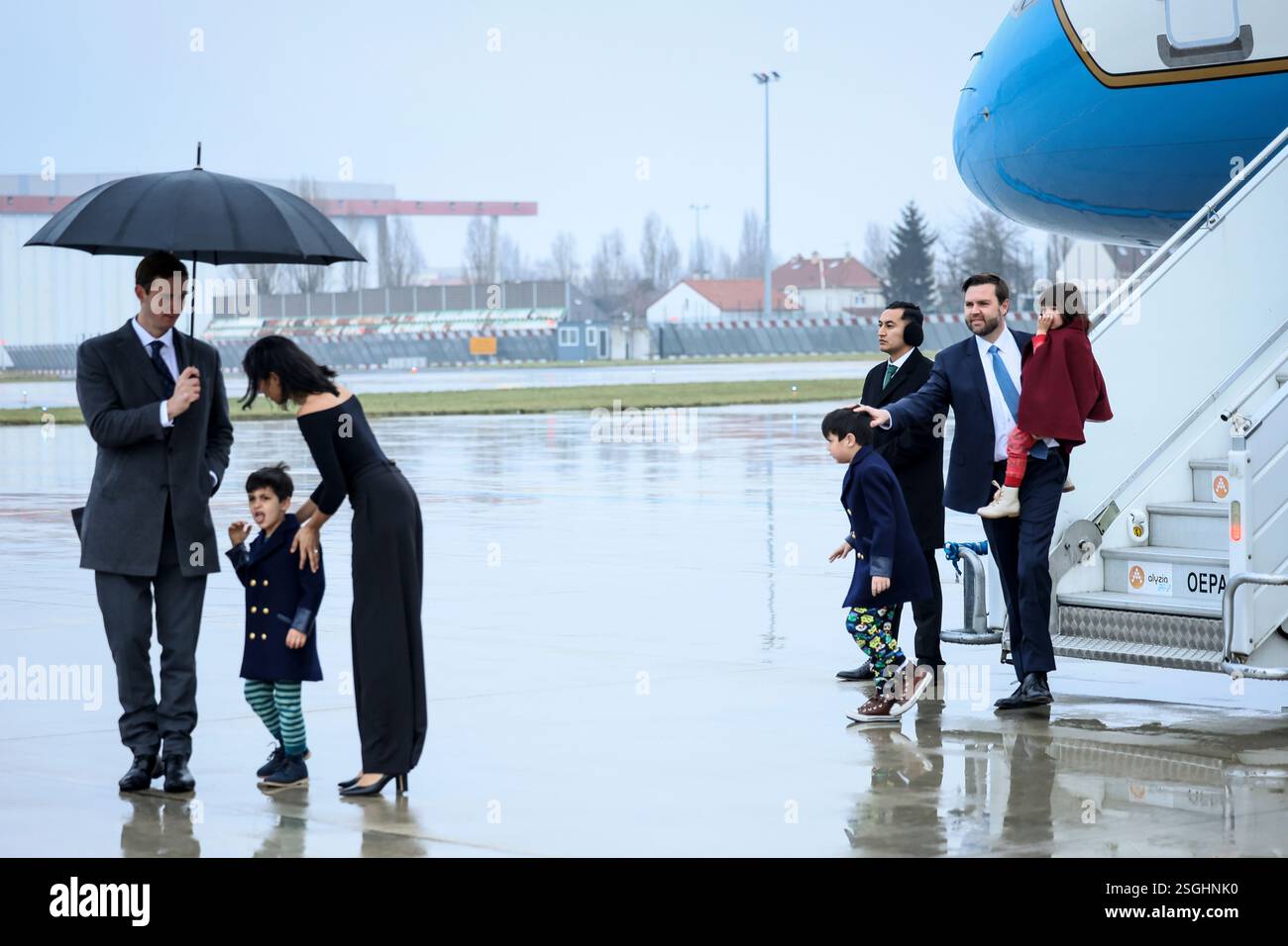 United States Vice-President JD Vance, right, carries his daughter ...