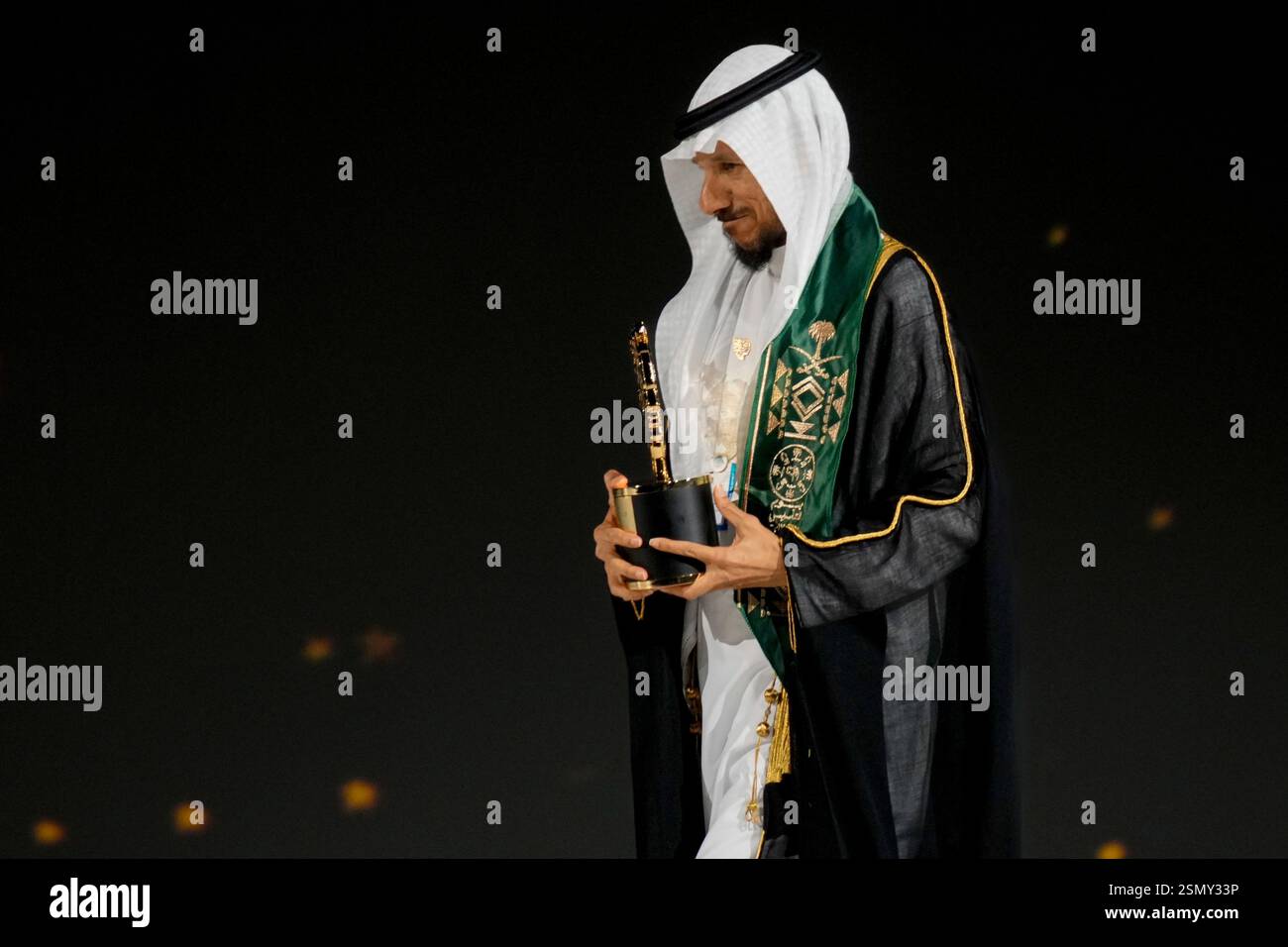 Saudi Arabian teacher Mansour bin Abdullah Al-Mansour, walks off the stage after receiving the ...