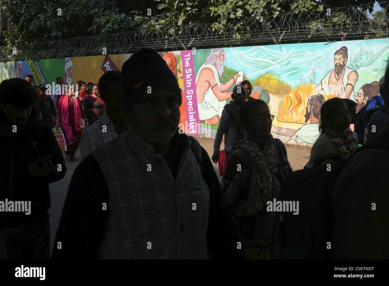 Indian Hindu devotees arrive for a holy dip at the Sangam, the ...